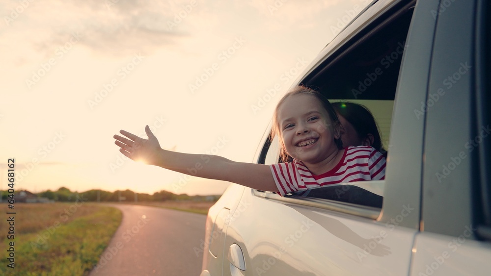 Little girl kid enjoys family trip by car. Child, stretching his hand ...