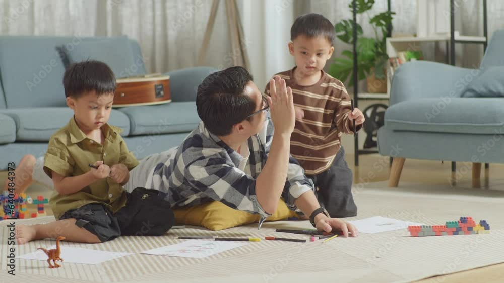 Full Body Of Asian Father And Sons On The Floor In The Room With ...