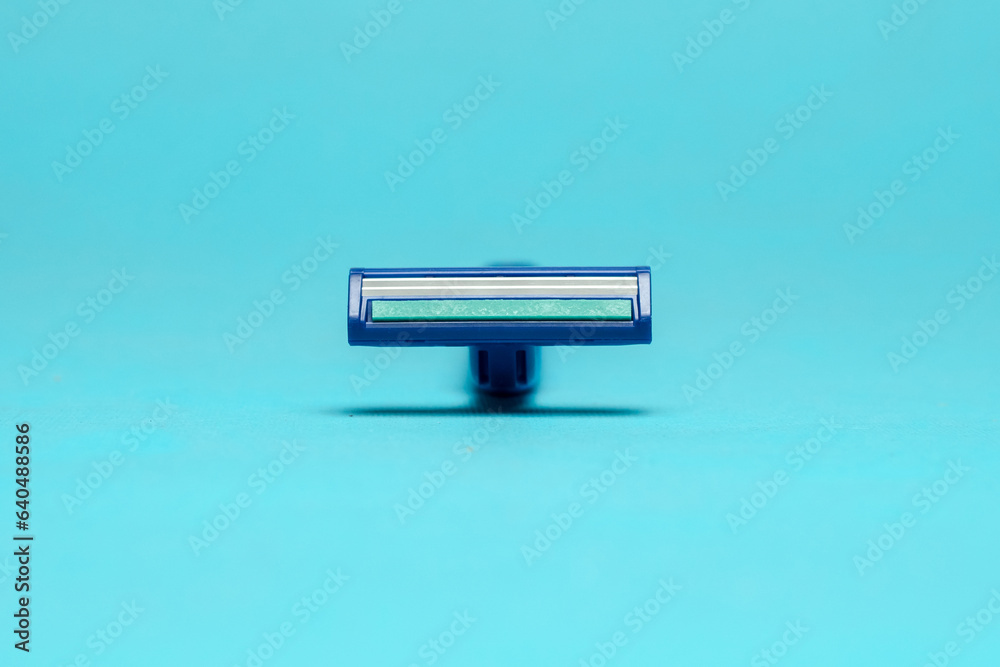 Blue razor blade with blue background Stock Photo | Adobe Stock