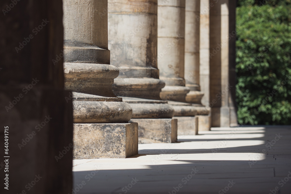 detail of light and shadow on a stylobate of a column or pillar in a ...