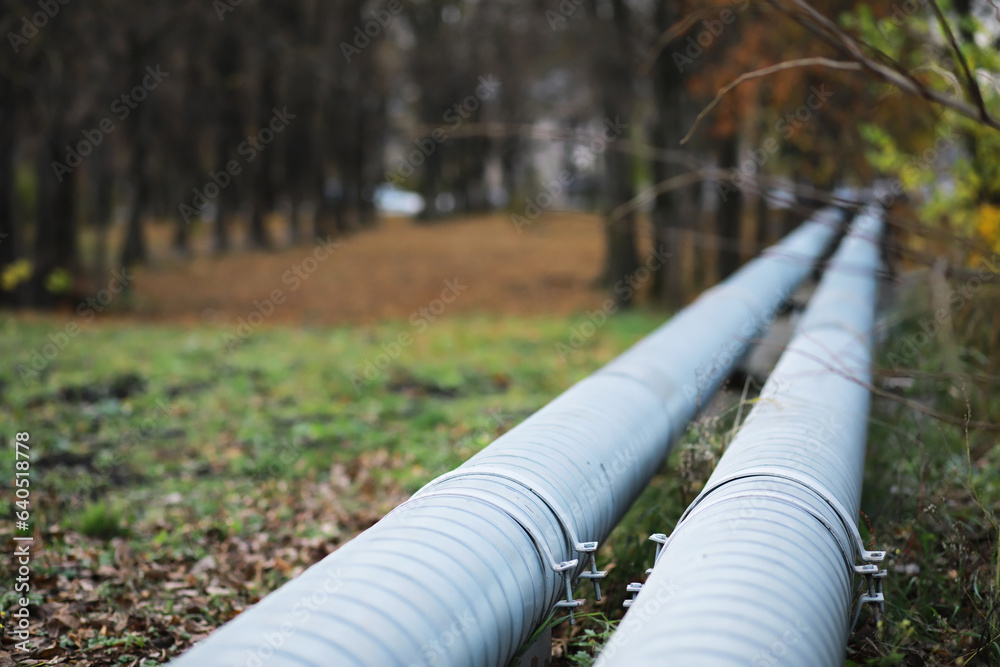 Metal pipes on the street. pipes from the pipeline. gas pipeline for ...