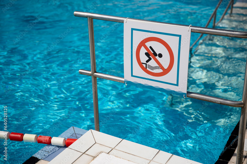 Pictogram shows no jump into swimming pool. Stock Photo | Adobe Stock