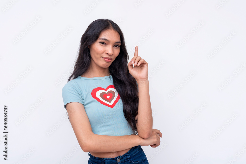 A young Filipino trans woman giving tips. Pointing up with her finger ...