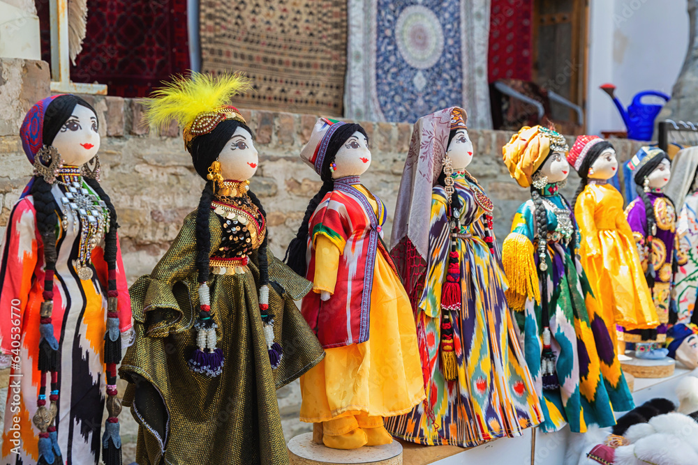 Dolls dressed in traditional uzbek costumes. Traditional souvenir ...