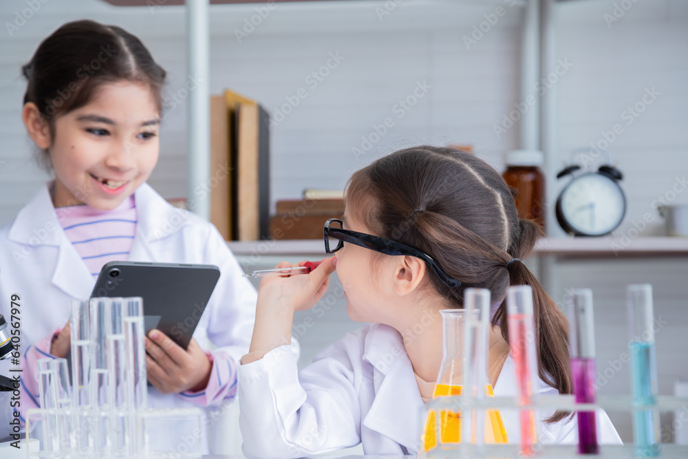 Unfocus close-up group of cute elementary student girls scientist ...