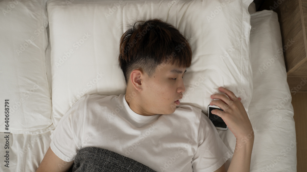 view from above mobile phone accidentally falling out of hand while the ...