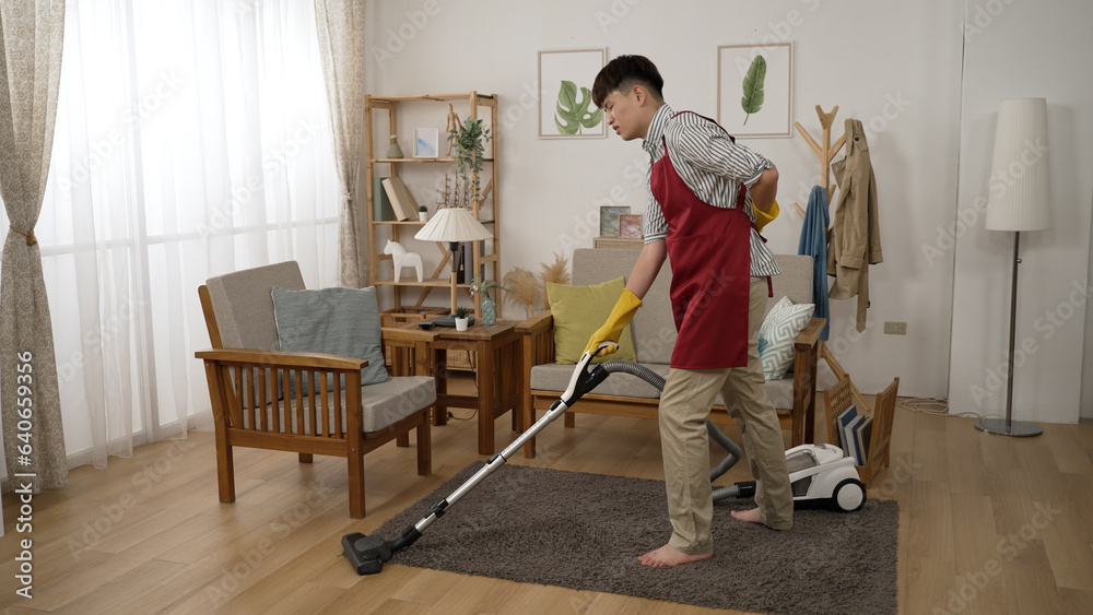 full length with side view asian man housekeeper in gloves and apron ...