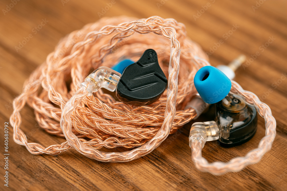 In ear monitor on a tablature background. Custom in-ear monitors with ...