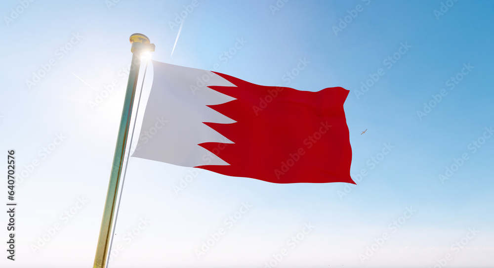 Flag of Qatar flag waving in the wind, sky and sun background. Qatar ...