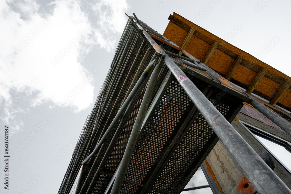 Scaffolding on multi storey building facade during facade renovation ...