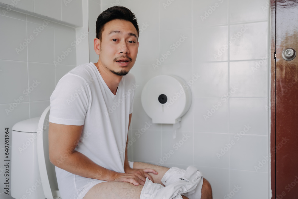 Funny happy face of asian man able to poop after suffer from ...