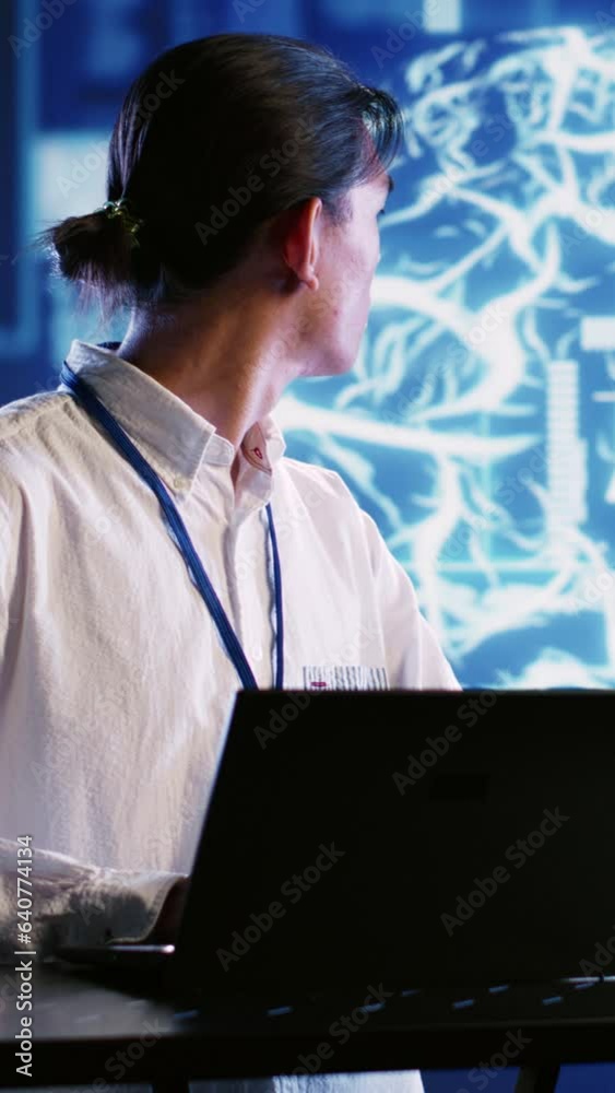 Vertical video Admin using laptop to visualize artificial intelligence ...
