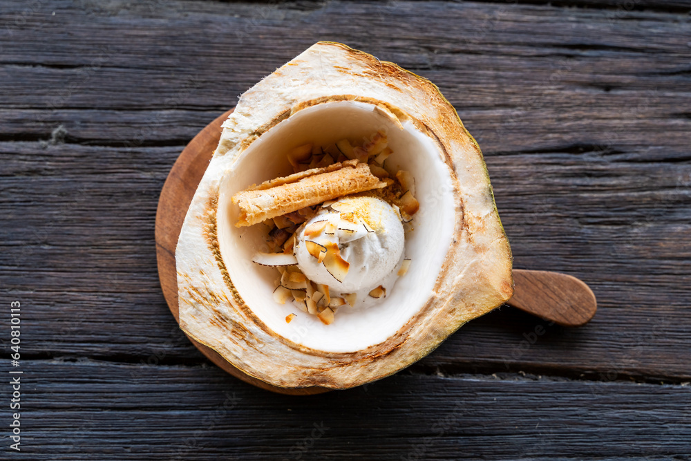 Natural and snow-white coconut ice cream sprinkled with crumbs, lying ...