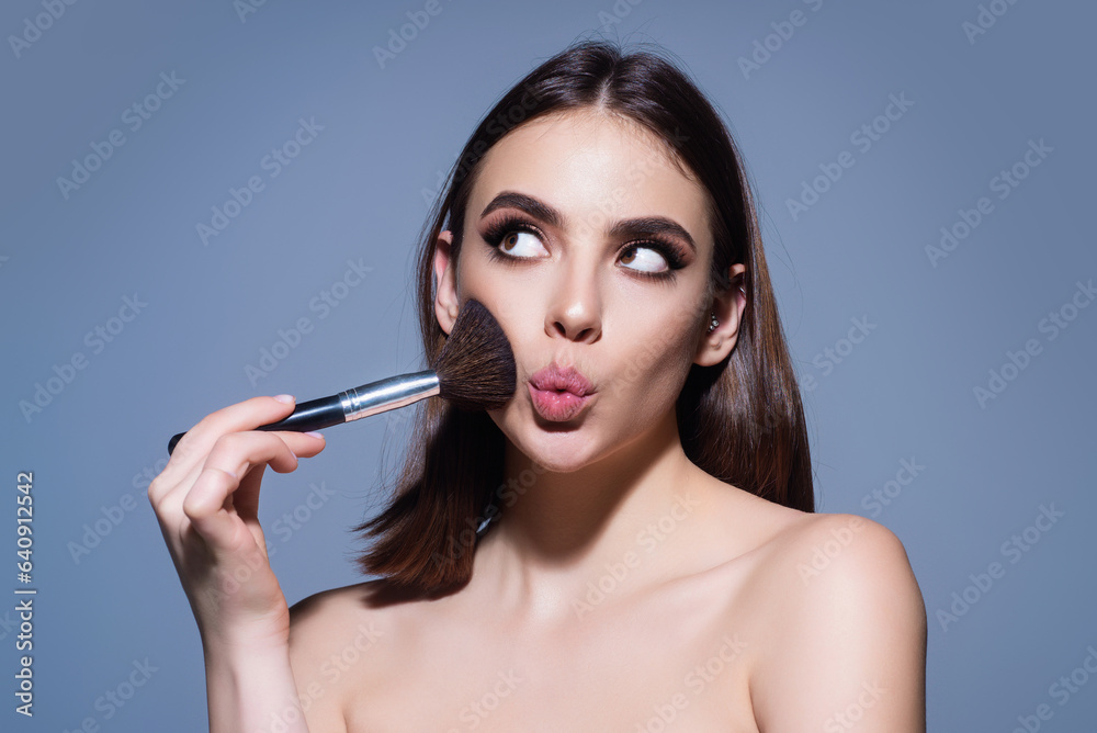 Girl hold blush blusher apply powder visage isolated over studio ...