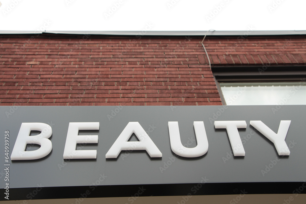 horizontal sign that says beauty caption writing text on it in white ...