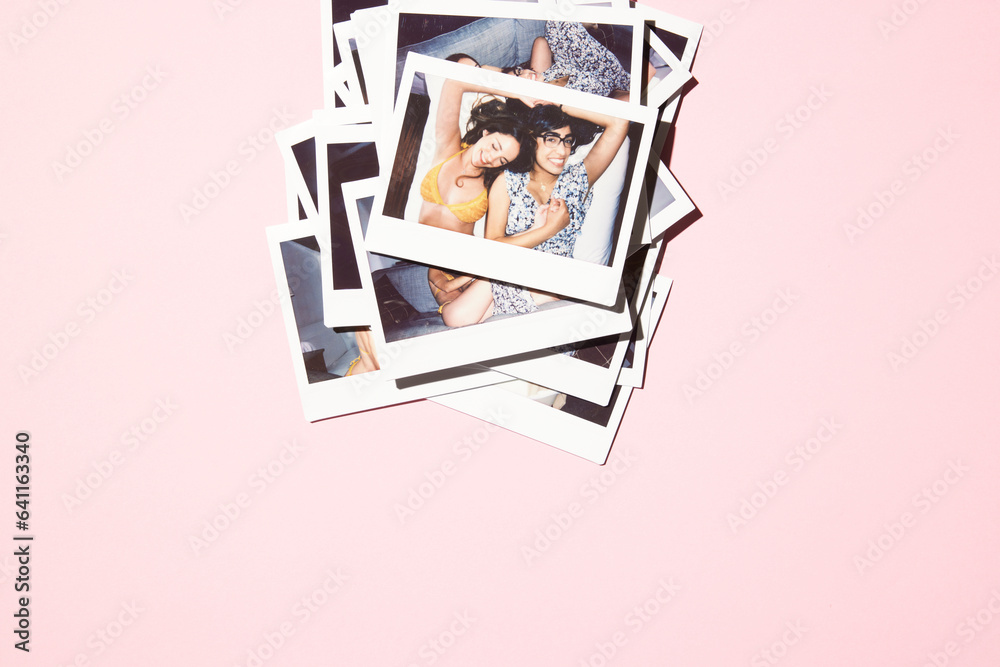 Pile Of Polaroids With two multiracial young women Having Fun Together ...