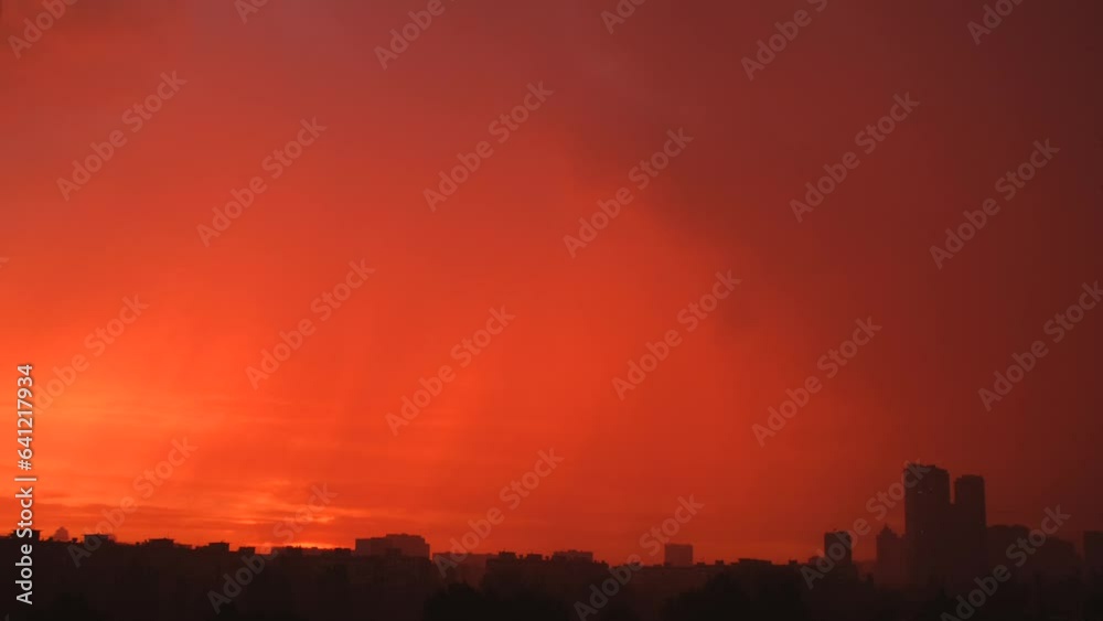 Dramatic storm timelapse. Epic cloudy rainy sunset over city buildings ...