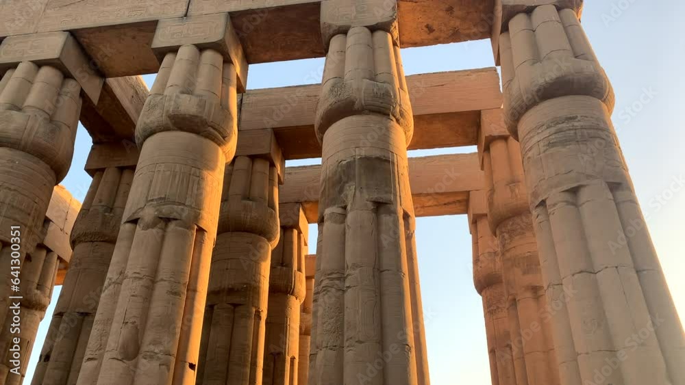 Luxor temple, Egypt. Slow pan showing tops of rows of massive columns ... Luxor temple, Egypt. Slow pan showing tops of rows of massive columns ...