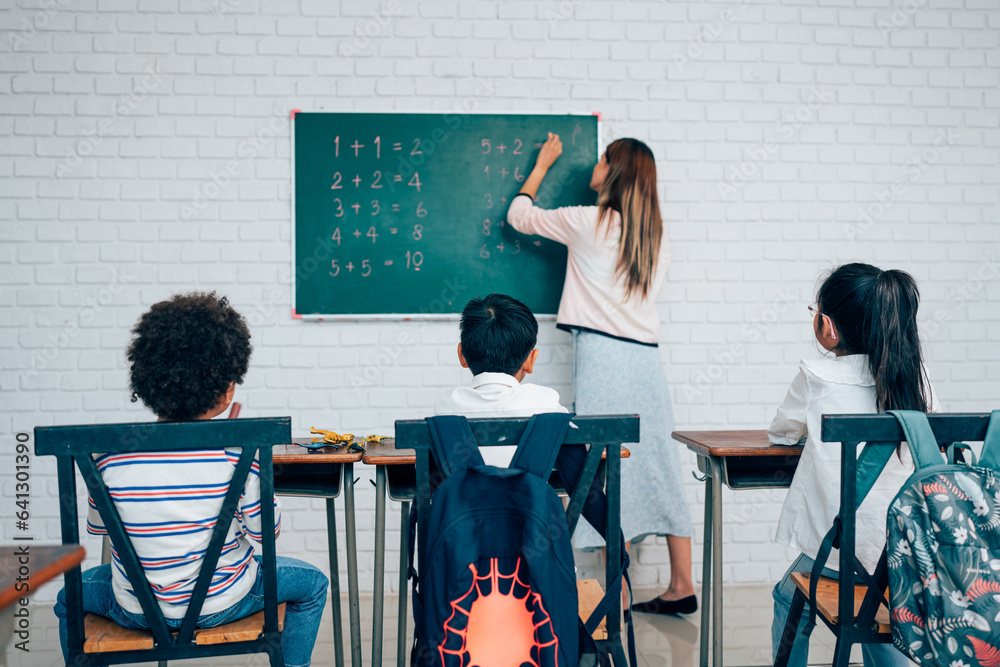 Happy school teacher and students having interesting engaging ...
