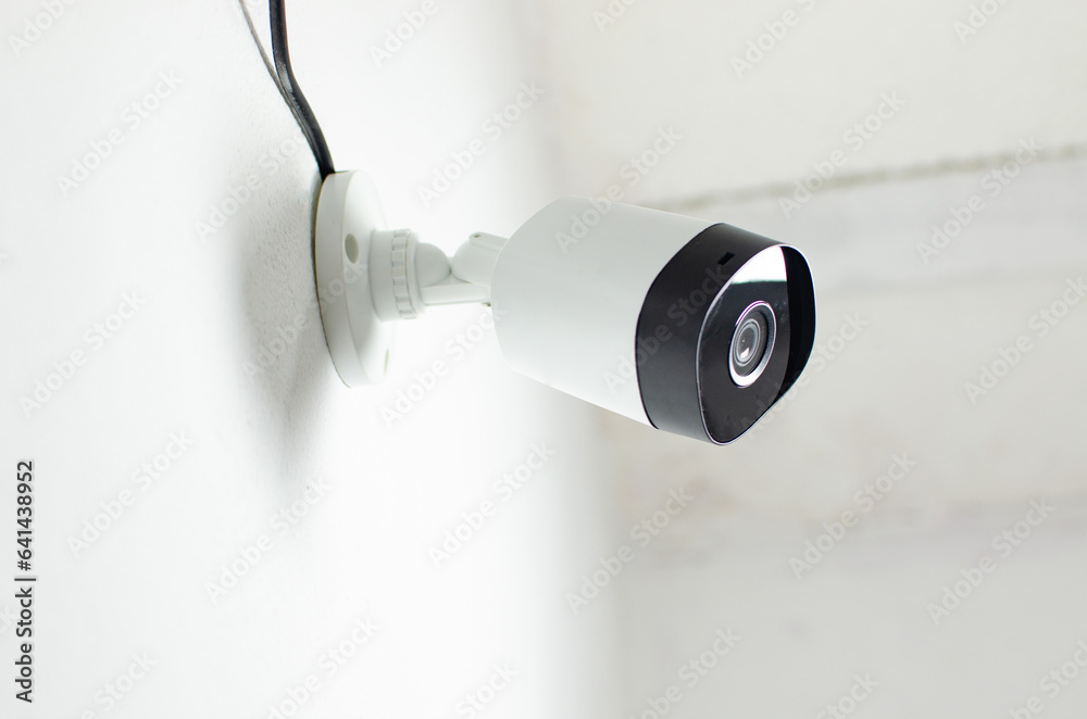 Detail of a white security camera, showing the fundamental role of this ...