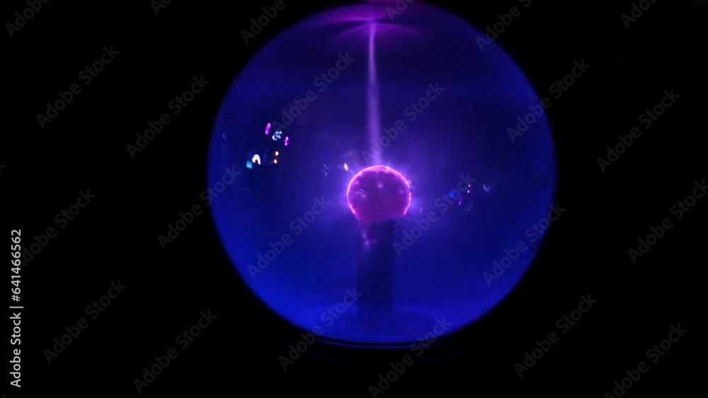 Tesla coil. Plasma globe. Blue and purple light beams. Energy rays ...