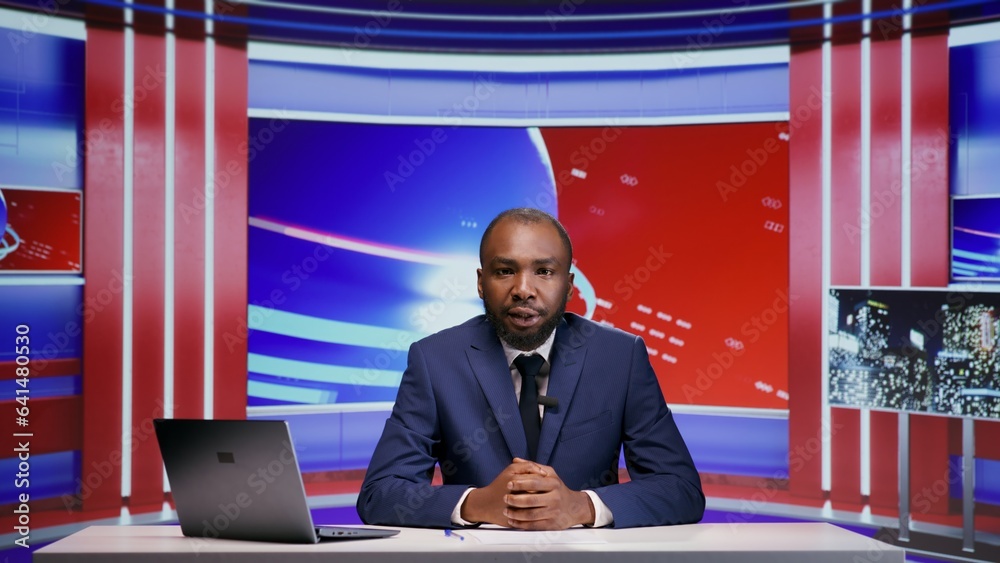 African american tv news anchor in studio presenting daily world events ...