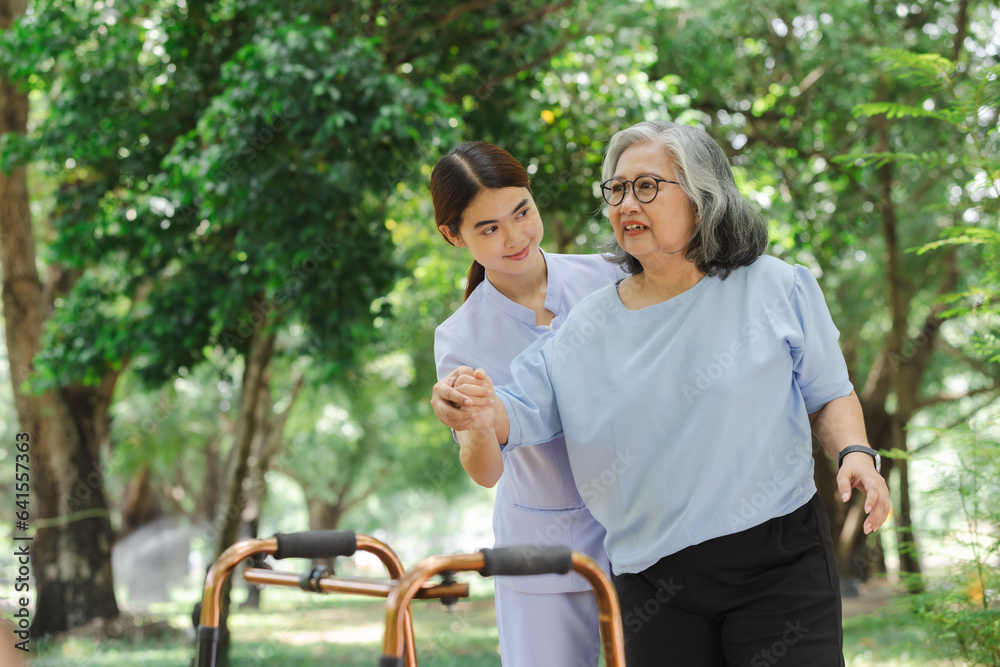 Foto de Elderly women using walking aids for exercises to improve ...