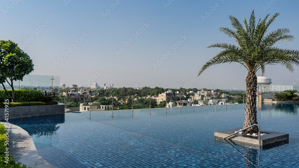Infinity pool on the roof with panoramic views of the city. You can see ...