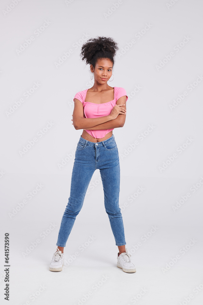 Elegance defined: Woman donning a pink shirt and blue jeans strikes a ...