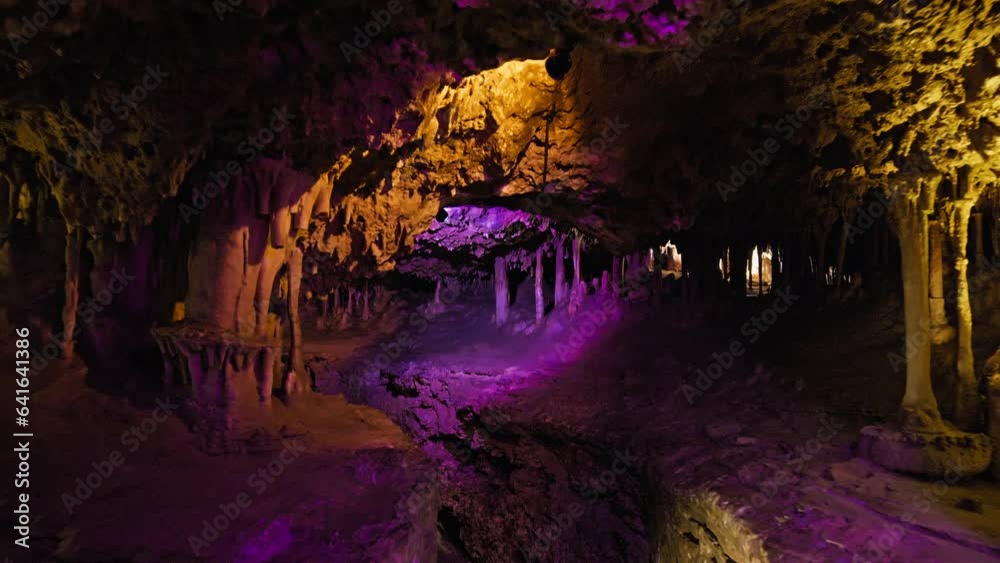 Underground cave tunnels of rocky formations of stalactites and ...