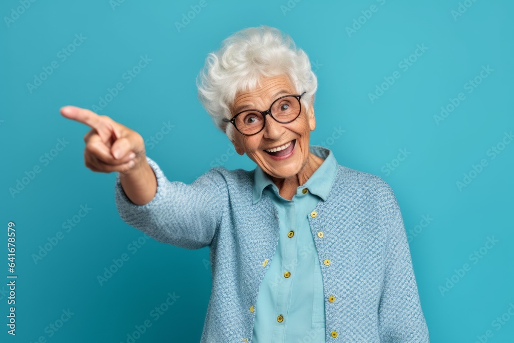 Lifestyle portrait photography of a happy old woman pointing empty ...