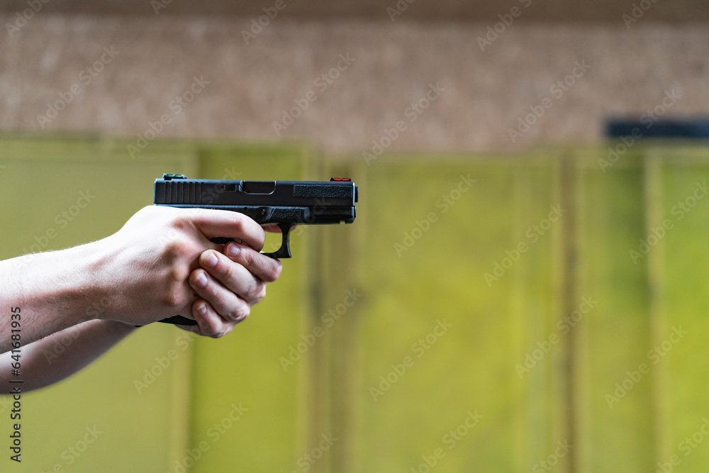 Shooting from a pistol in a shooting range, close-up photo. Stock Photo ...