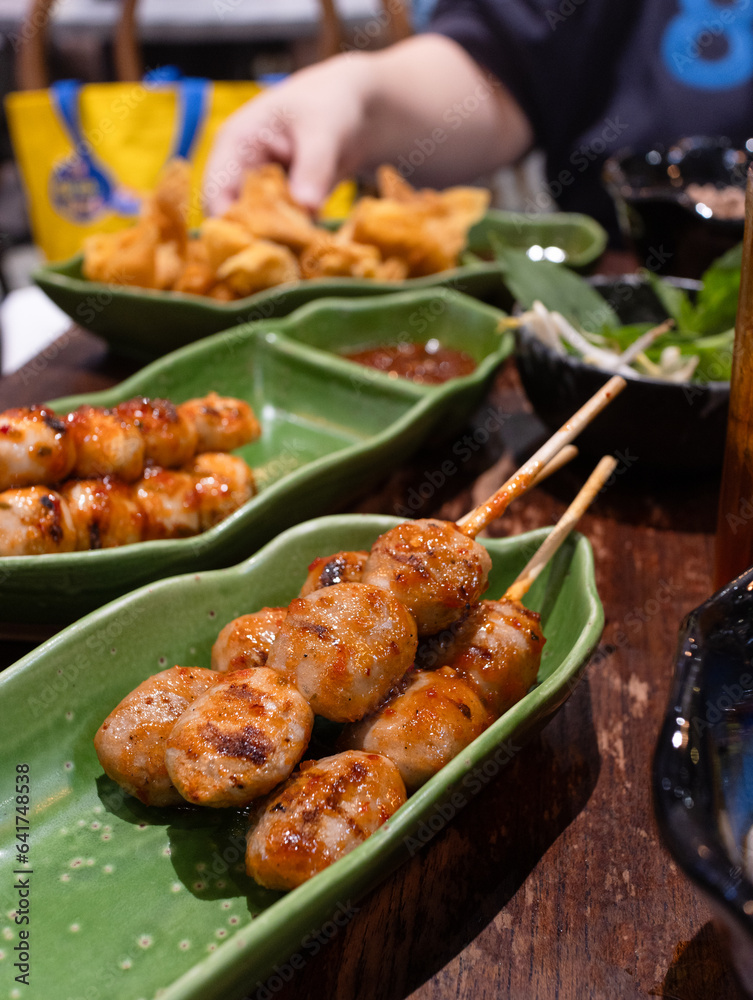 Traditional Thai meatball in a plate with spicy sauce on it. Meatballs ...