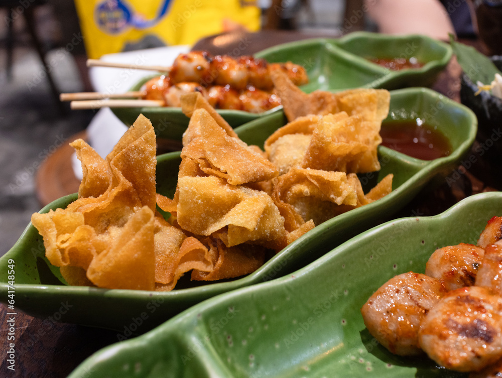 Deep fried crispy wonton or fried wrapper with its sauce. Wonton are a ...