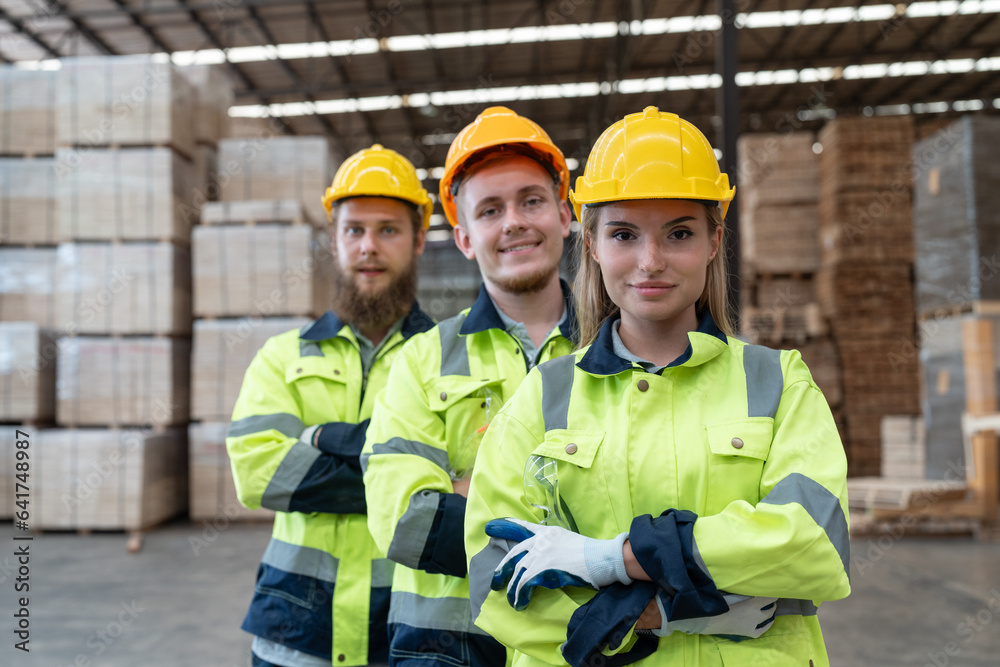 Portrait of group of man and woman workers working at wood pallet ...