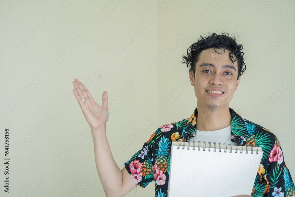 Young curly man wear beachwear with click thumbnail pose with paper ...