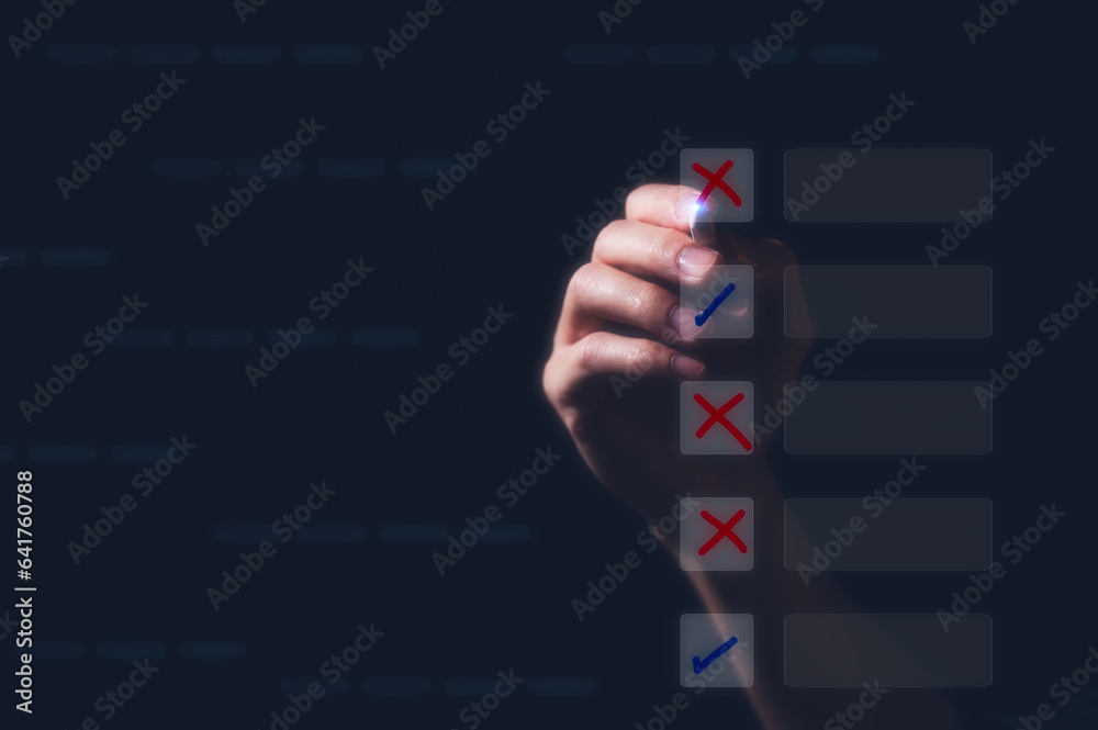 Businessman using pen tick mark and cross in checkbox for quality ...