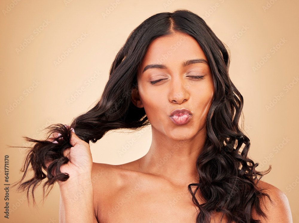 Happy, hair care and a woman with a pout on a studio background for ...