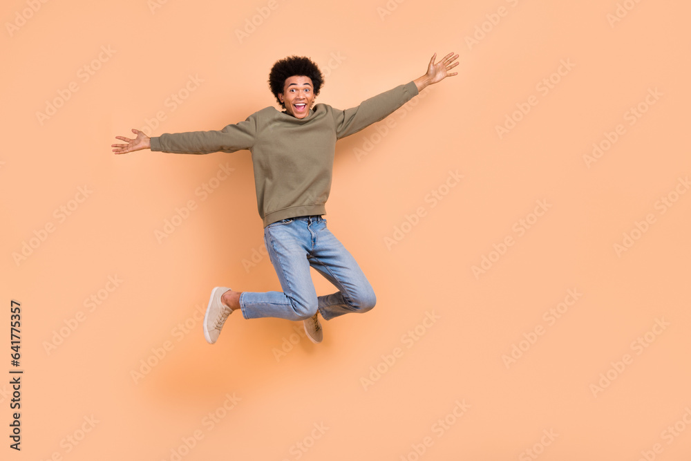 Full body photo cadre of young careless student guy fly wings jump ...