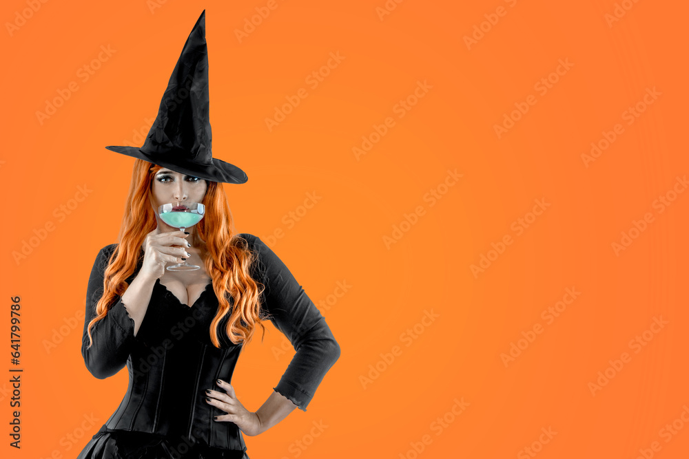 Halloween Witch making witchcraft, drinking a magic potion cocktail ...