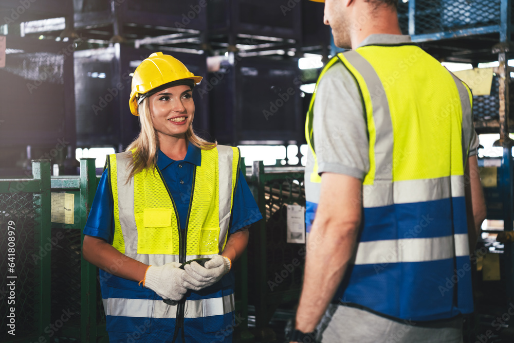Caucasian Male and Female Warehouse Workers Wearing Safety Hardhat and ...