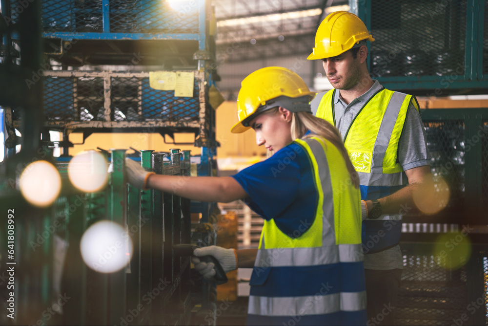Caucasian Male and Female Warehouse Workers Wearing Safety Hardhat and ...