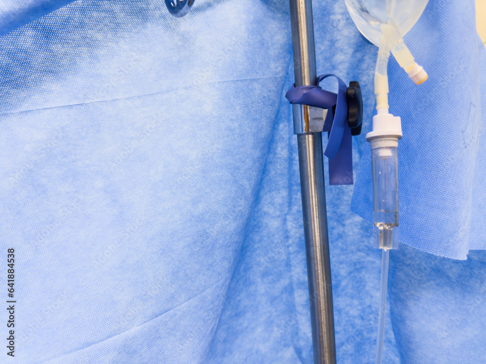 Medical supplies including syringes, IV drips, and drug vials symbolize ...