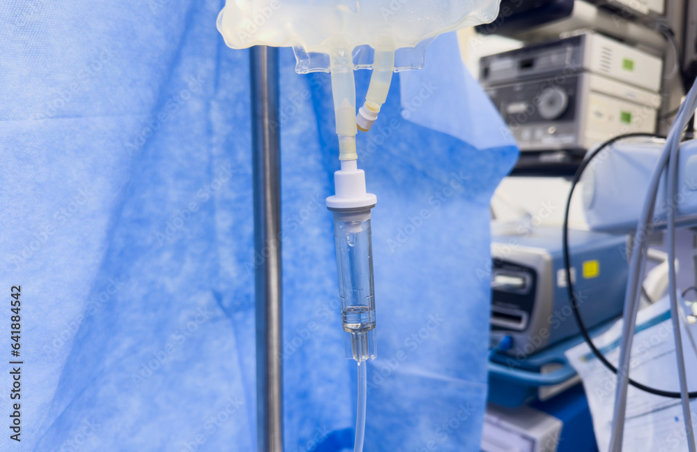 Medical supplies including syringes, IV drips, and drug vials symbolize ...