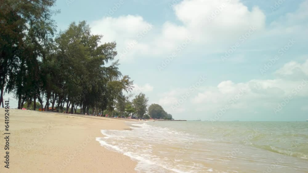 Daytime view of Pantai Puteri Beach in Malacca, Malaysia. Waves from ...