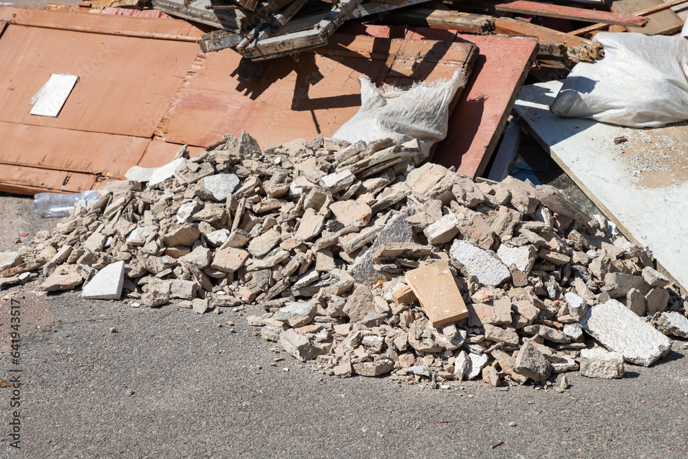 Construction waste. A pile of broken concrete debris and rubble ...