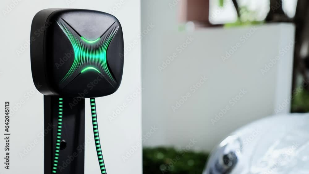 Electric car recharging from home charging station by futuristic EV ...
