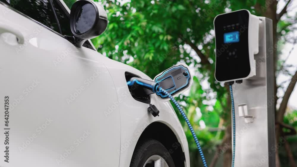 Electric car recharging battery by futuristic smart EV charger from eco ...