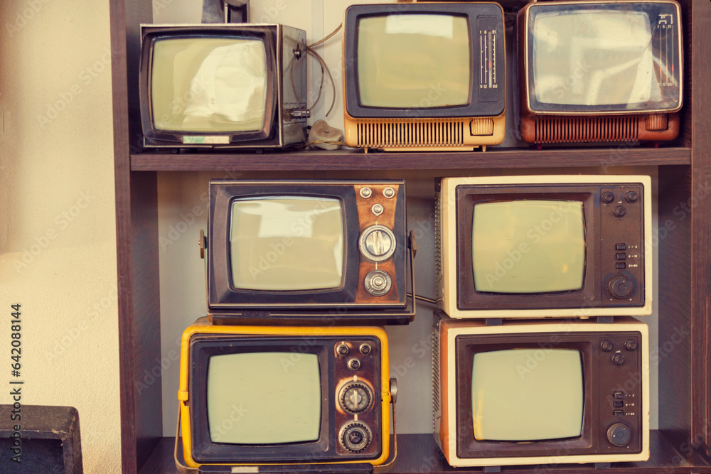 Many retro television. vintage old TV is colorful multi-row. Seeing the ...