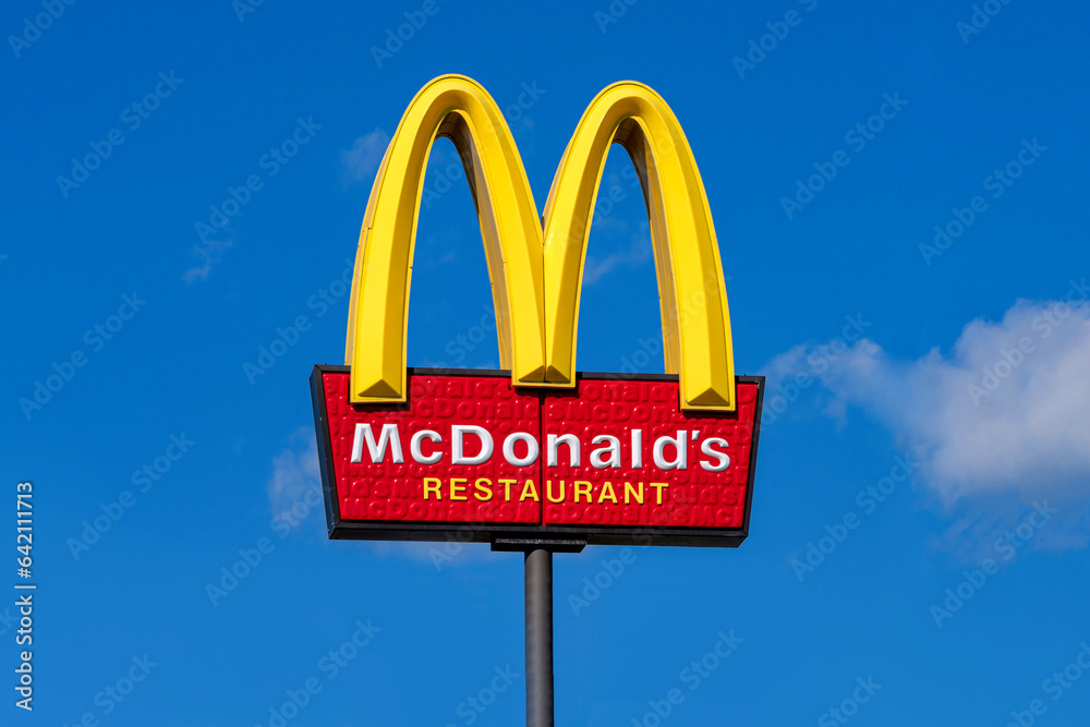 Famous McDonald's Drive through sign with blue sky in background ...